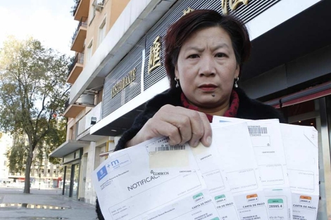 La ruina de Zhang Xia Fen en su tienda de ultramarinos de la zona de ...